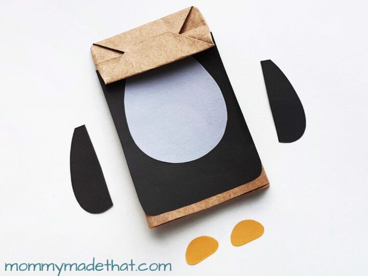 Paper Bag Penguin Craft (With Free Printable Puppet Template)